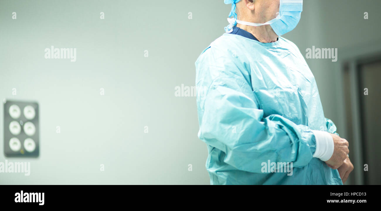 Surgeon in hospital surgery in sterile uniform "scrubs" in operating ...