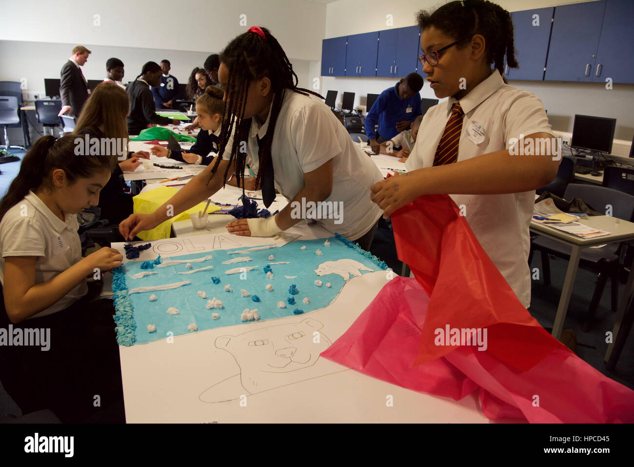 School children designing a poster Stock Photo - Alamy