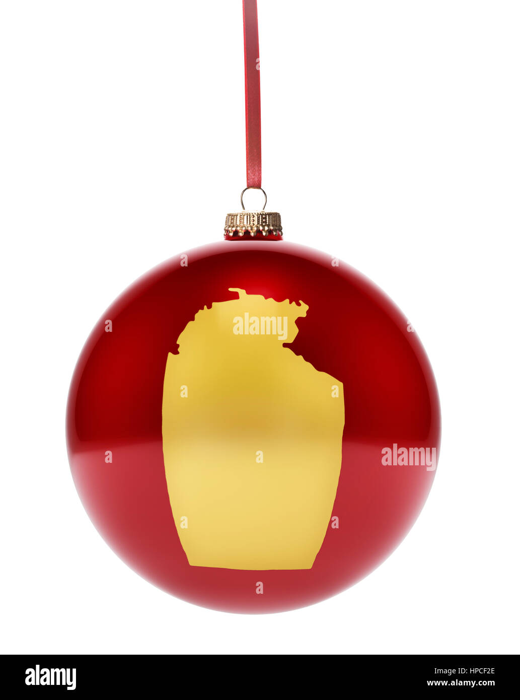 A hanging glossy red bauble with the golden shape of Northern Territory ...