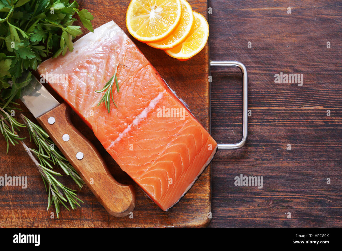 fresh red fish fillet of salmon with lemon and herbs Stock Photo - Alamy