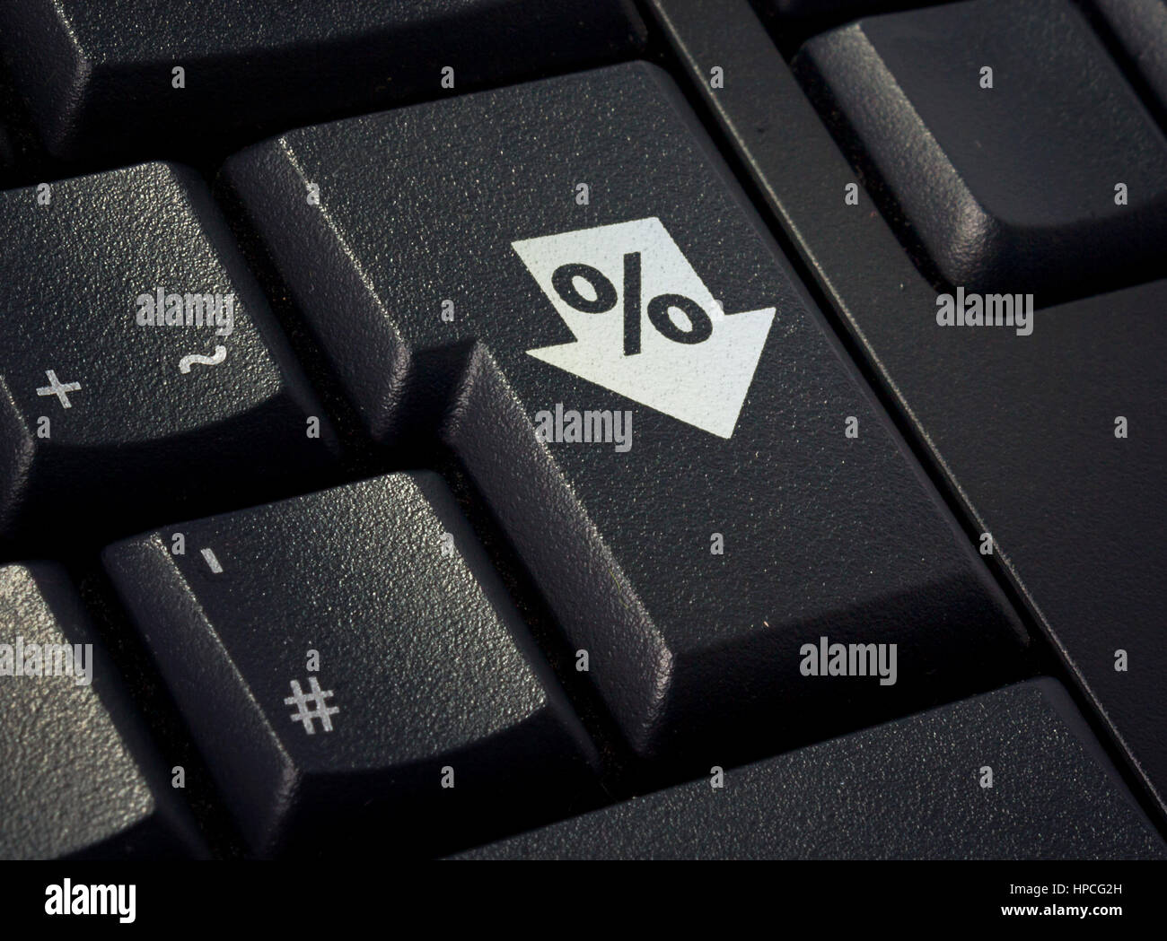 Return key of a black keyboard with the shape of a discount imprinted ...