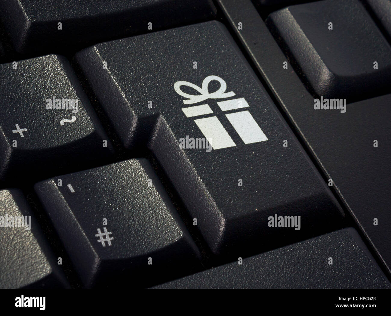 Return key of a black keyboard with the shape of a gift imprinted ...