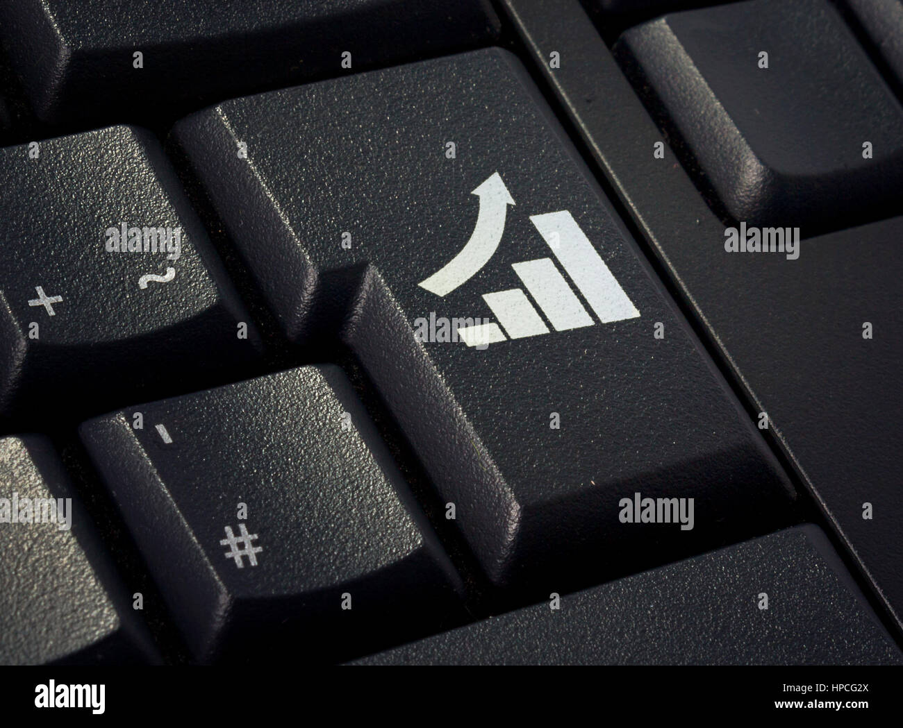 Return key of a black keyboard with the shape of a growing bar chart ...