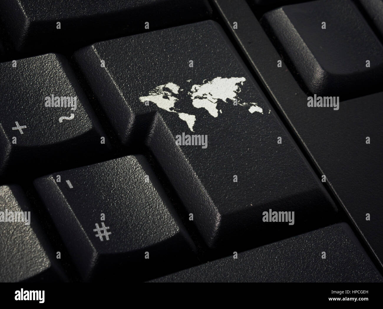 Return key in the shape of the world.(series Stock Photo - Alamy