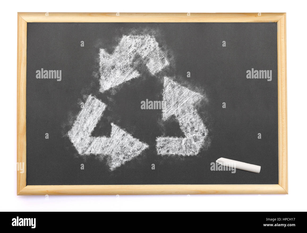Blackboard with arrows of recycling drawn on and a single chalk.(series ...