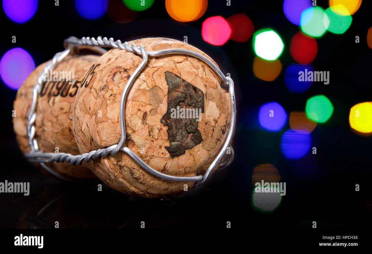 Champagne cork with the shape of Chad burnt in and colorful blurry ...