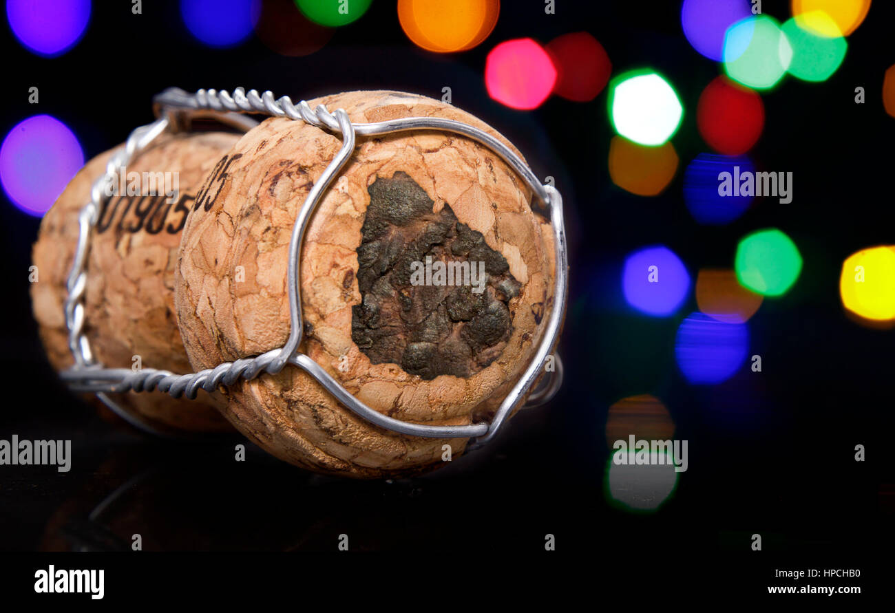 Champagne cork with the shape of Uruguay burnt in and colorful blurry ...