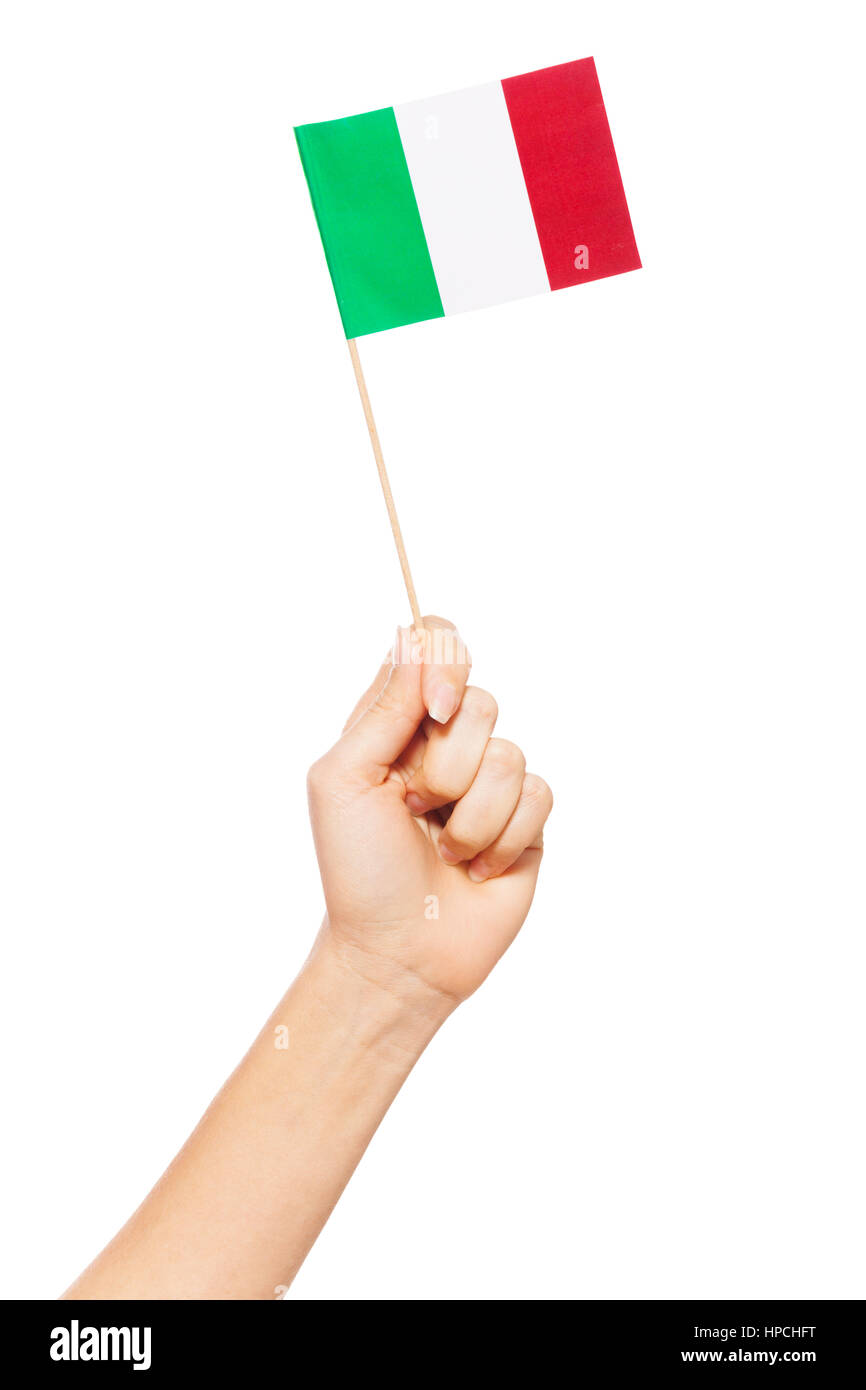 Woman's hand holding and raising small paper Italian flag, isolated on ...