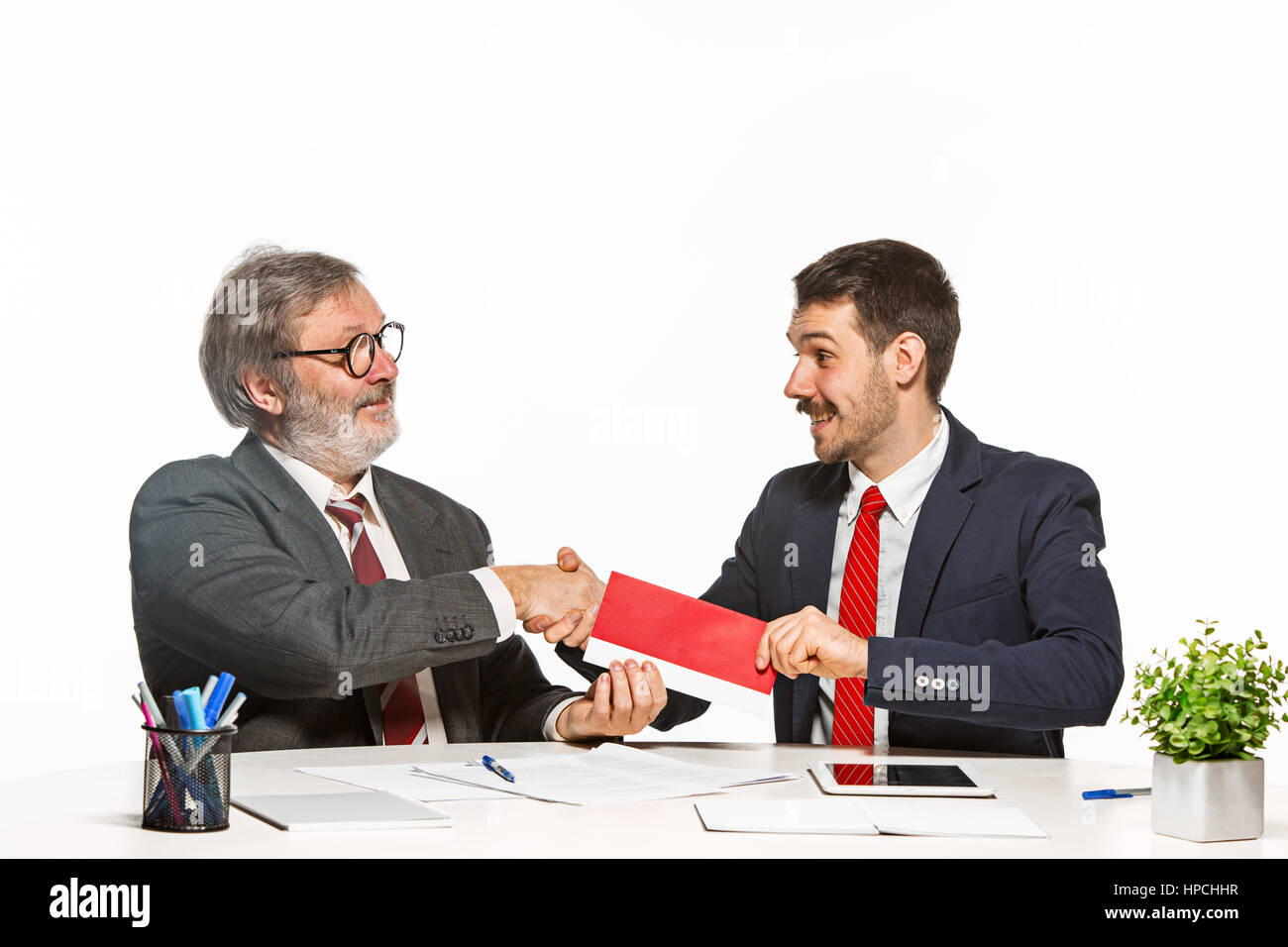Concept - corruption. Businessman in a suit taking a bribe at office on ...