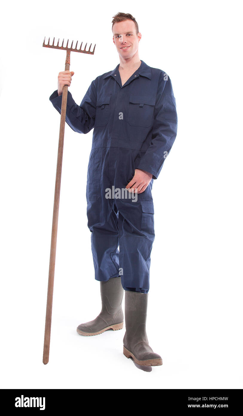 Young farmer with rake isolated on white background Stock Photo - Alamy