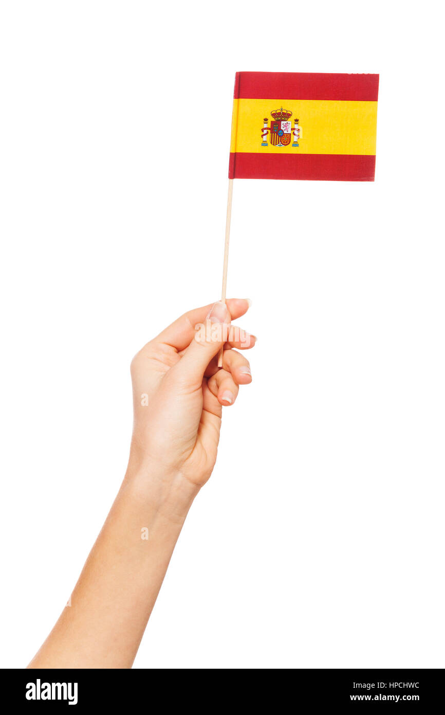 Hand holding the national flag of Spain by flagpole, isolated on white ...