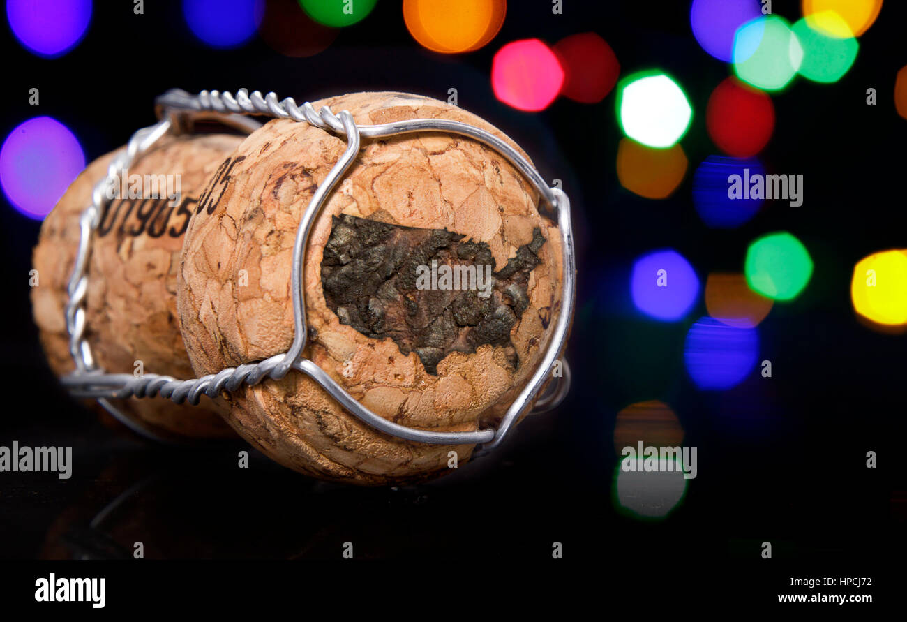 Champagne cork with the shape of USA burnt in and colorful blurry ...