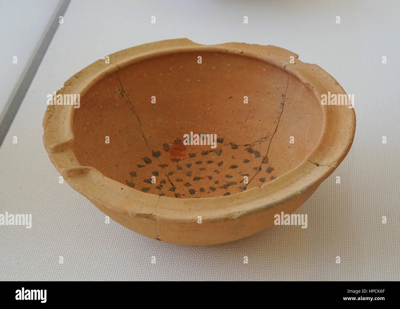 Roman era. Mortar. Clay. On the object background, volcanic stones to ...