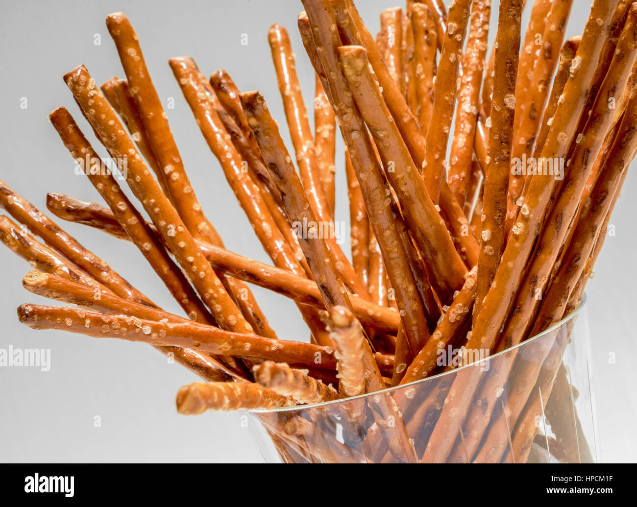 closeup of some salt sticks in a glass in grey back Stock Photo - Alamy
