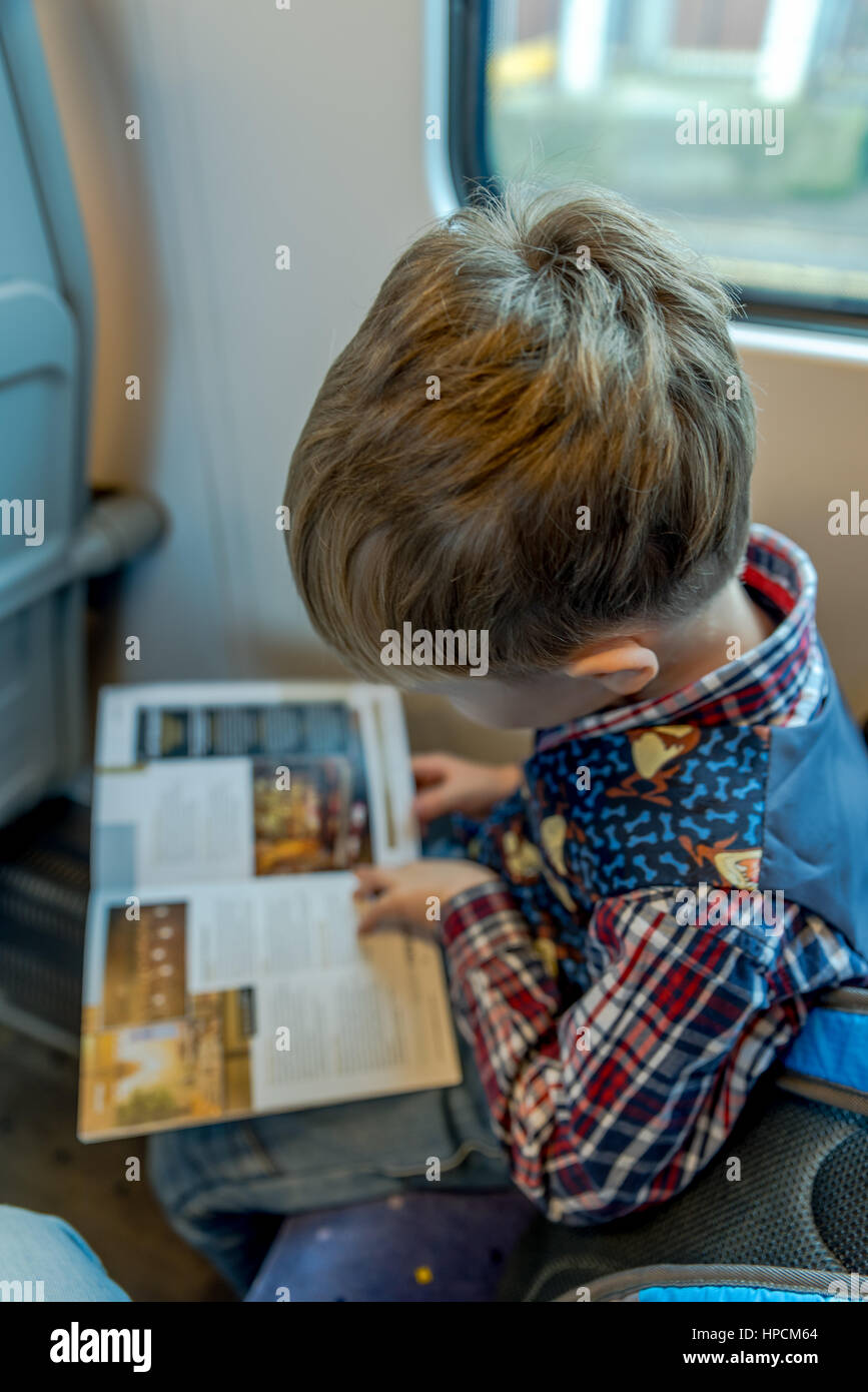 Reading book on train platform hi-res stock photography and images - Alamy