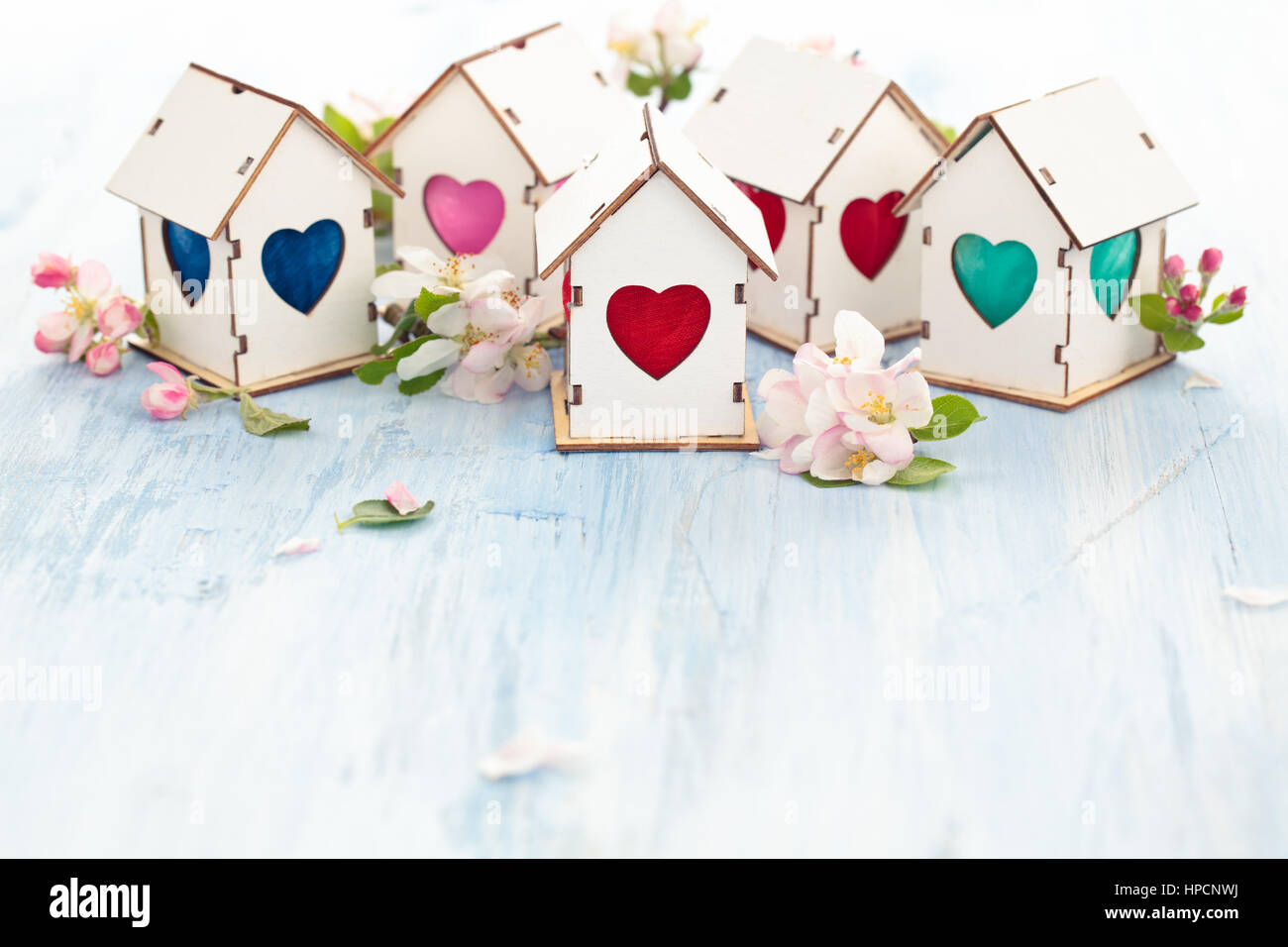 White wooden houses with colorful heart shaped windows Stock Photo - Alamy
