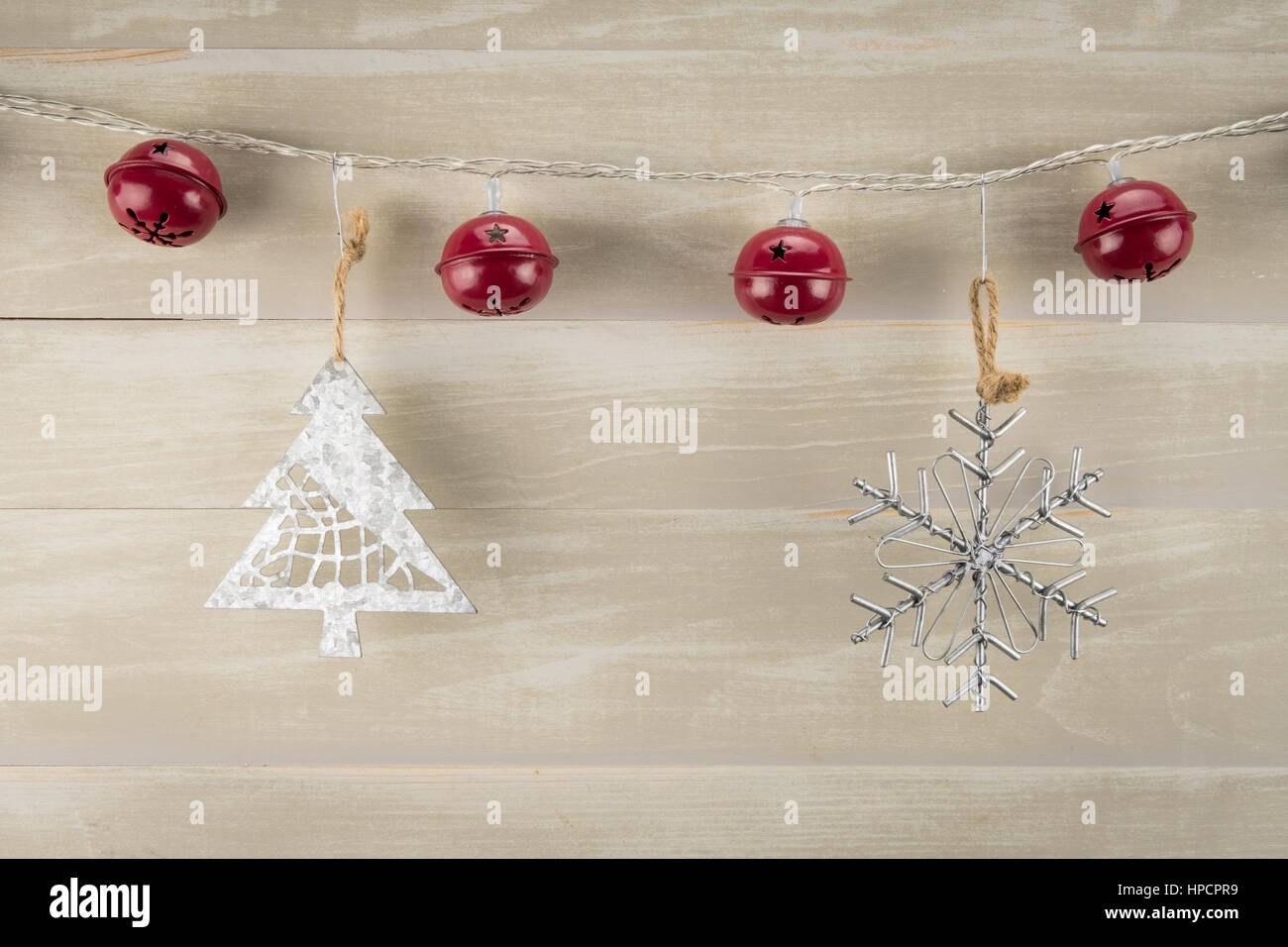 Red Bells with Tree and Snowflake Ornaments from string Stock Photo - Alamy
