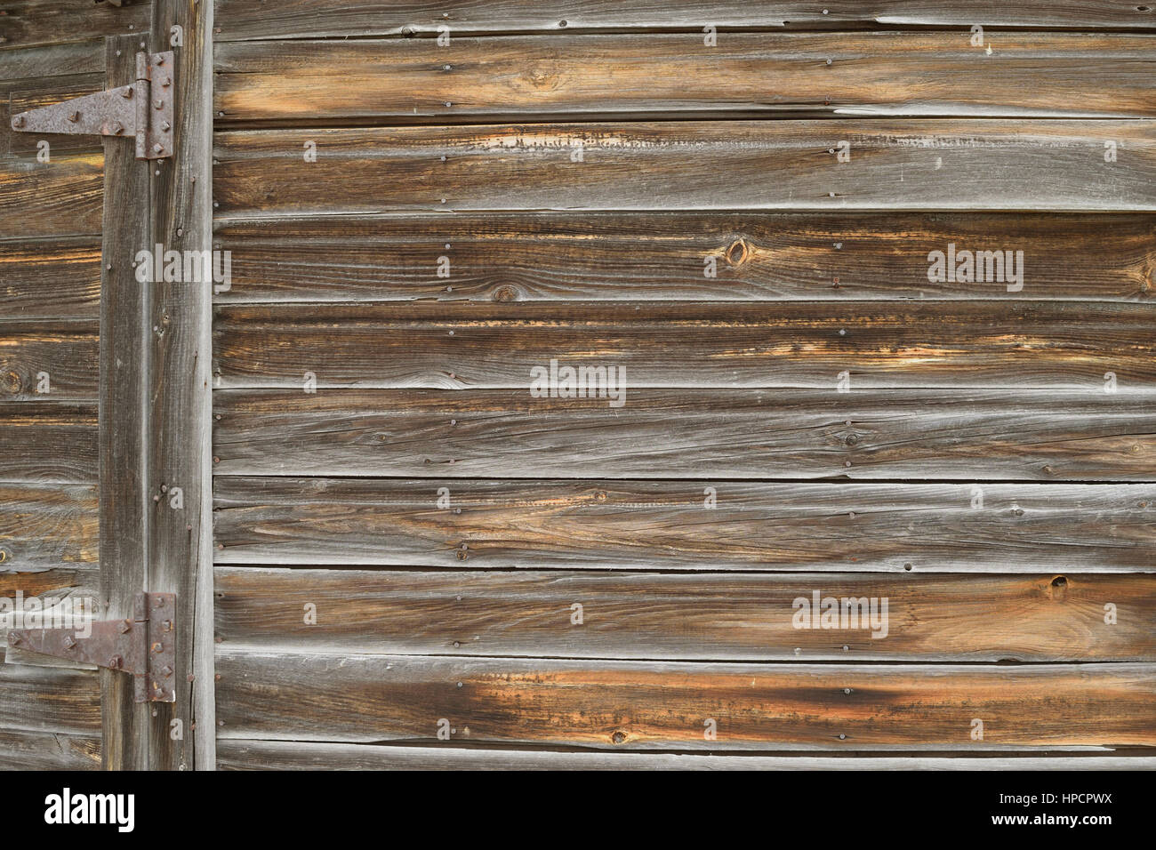 Rusty Barn Door Hinges and Weathered Wood Stock Photo - Alamy