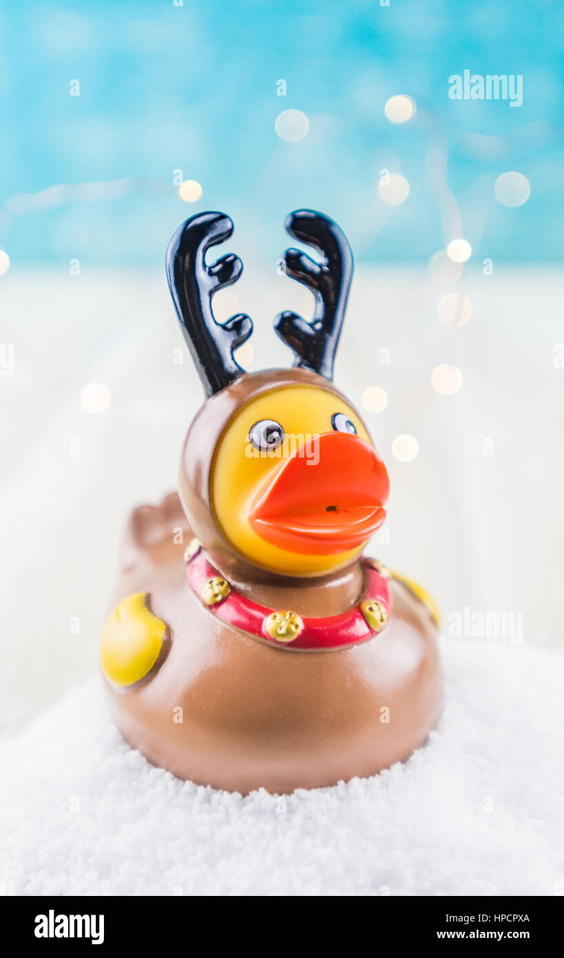 Rubber Duck Reindeer in Snow Vertical with whimsical blue background ...