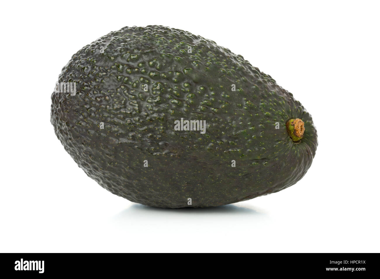 Uncut, whole, ripe avocado fruit on white background Stock Photo - Alamy