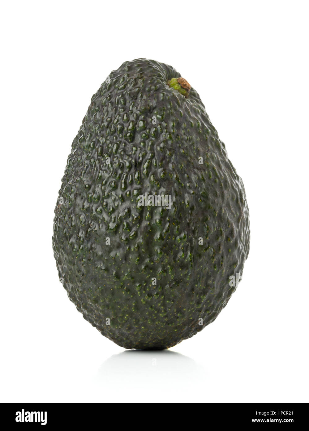 Uncut, whole, ripe avocado fruit on white background Stock Photo - Alamy