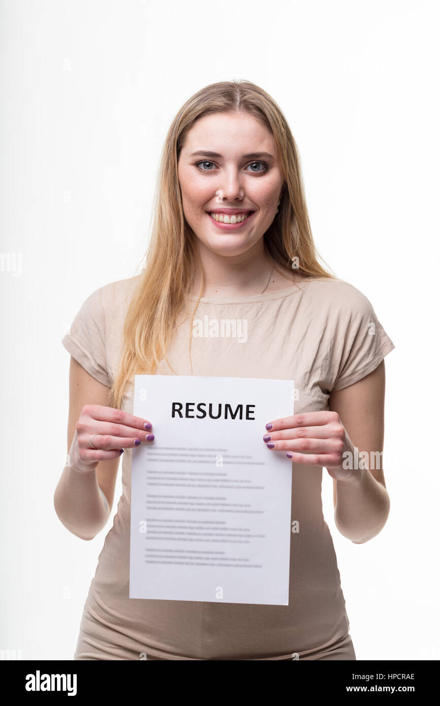Young smiling woman holding and showing her resume Stock Photo - Alamy