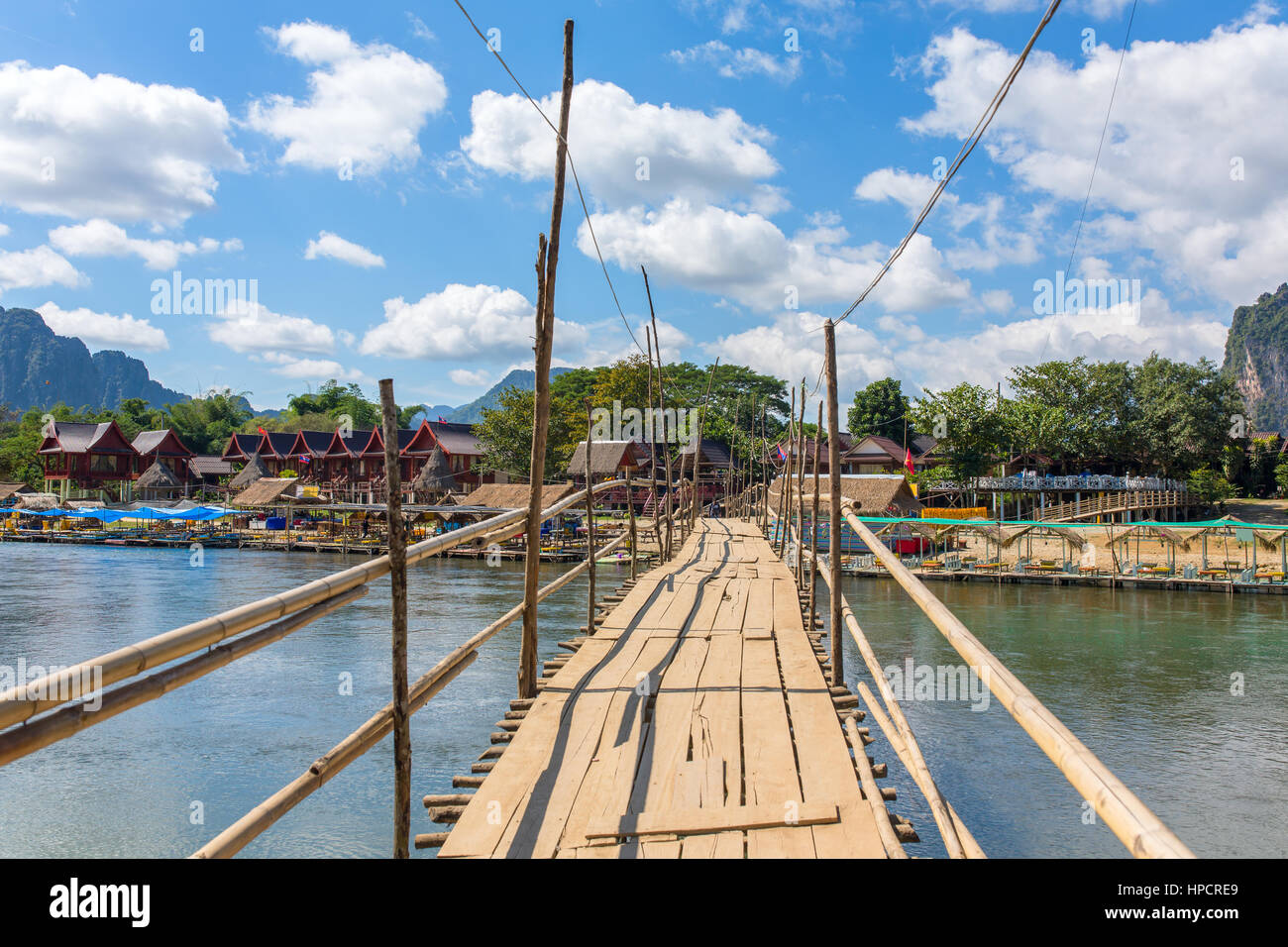 Wooden bridge across Nam Song river at Vang Vieng, Laos Stock Photo - Alamy