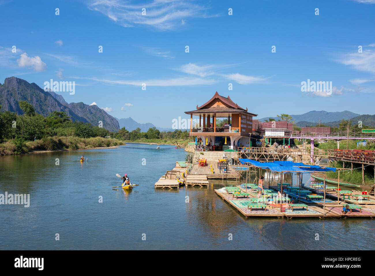Vang Vieng, Laos - January 19, 2017: Unidentified tourists are rowing ...