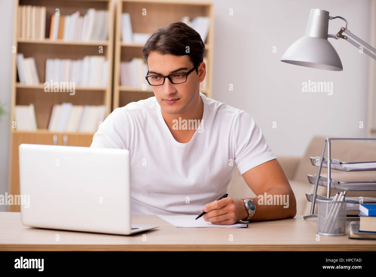 Young man working in the office Stock Photo - Alamy
