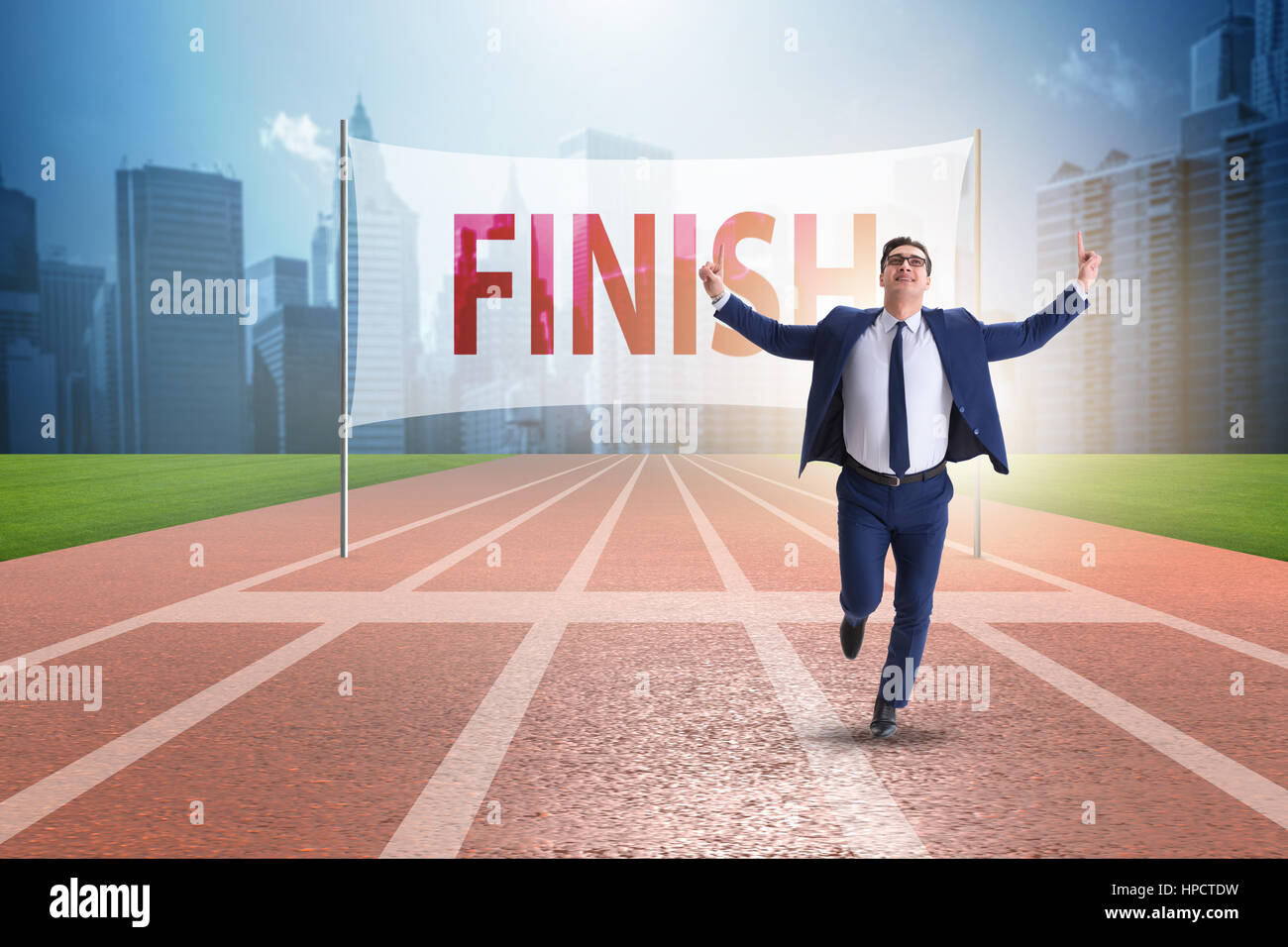 Businessman on the finishing line in competition concept Stock Photo ...