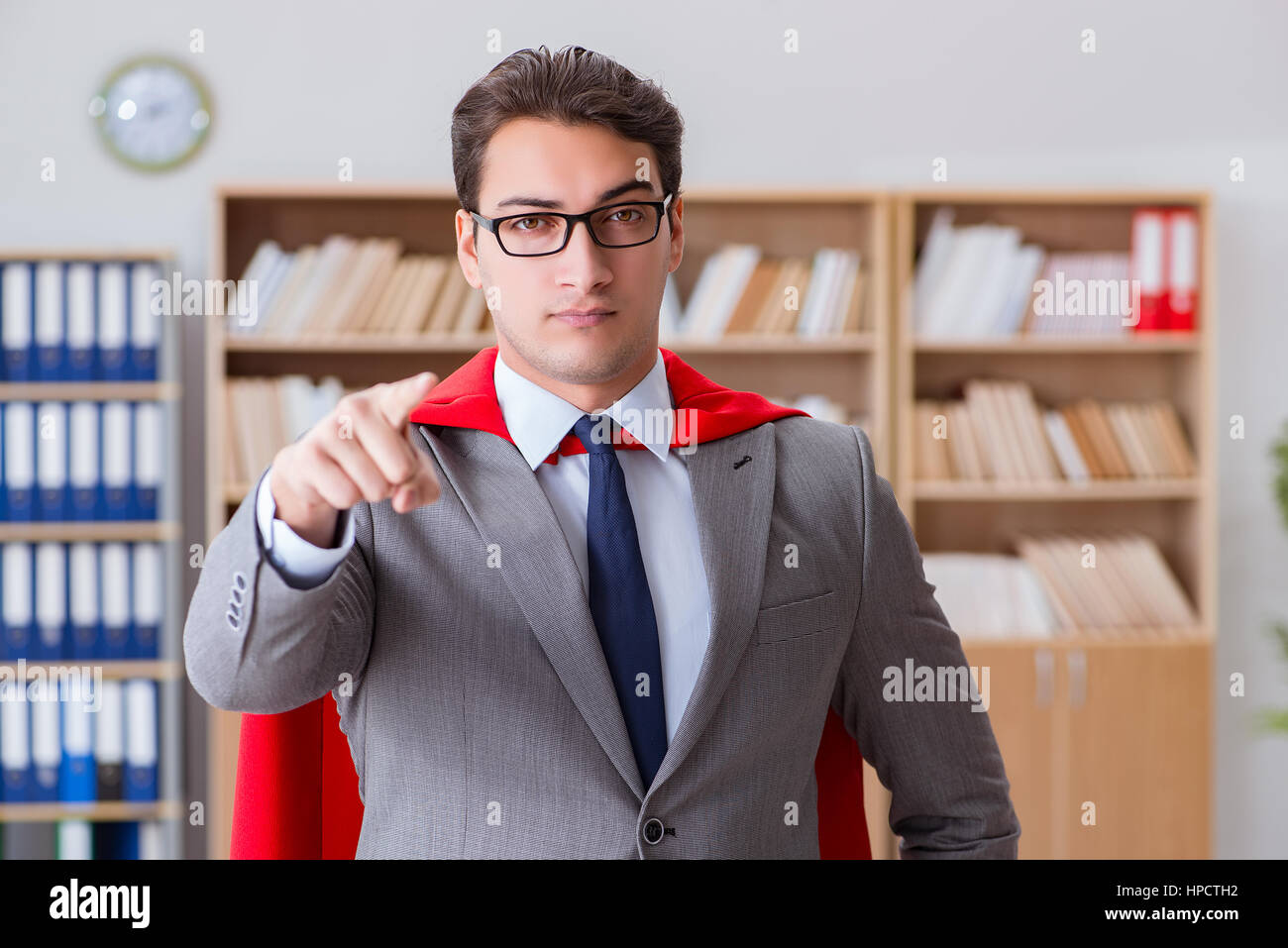 Superhero businessman working in the office Stock Photo - Alamy