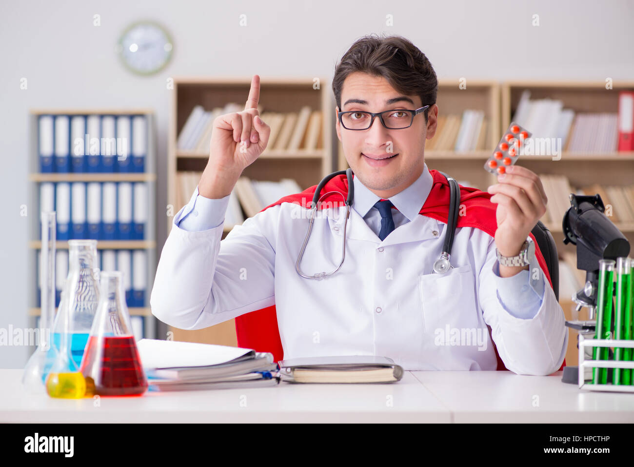 Superhero doctor working in the lab hospital Stock Photo - Alamy