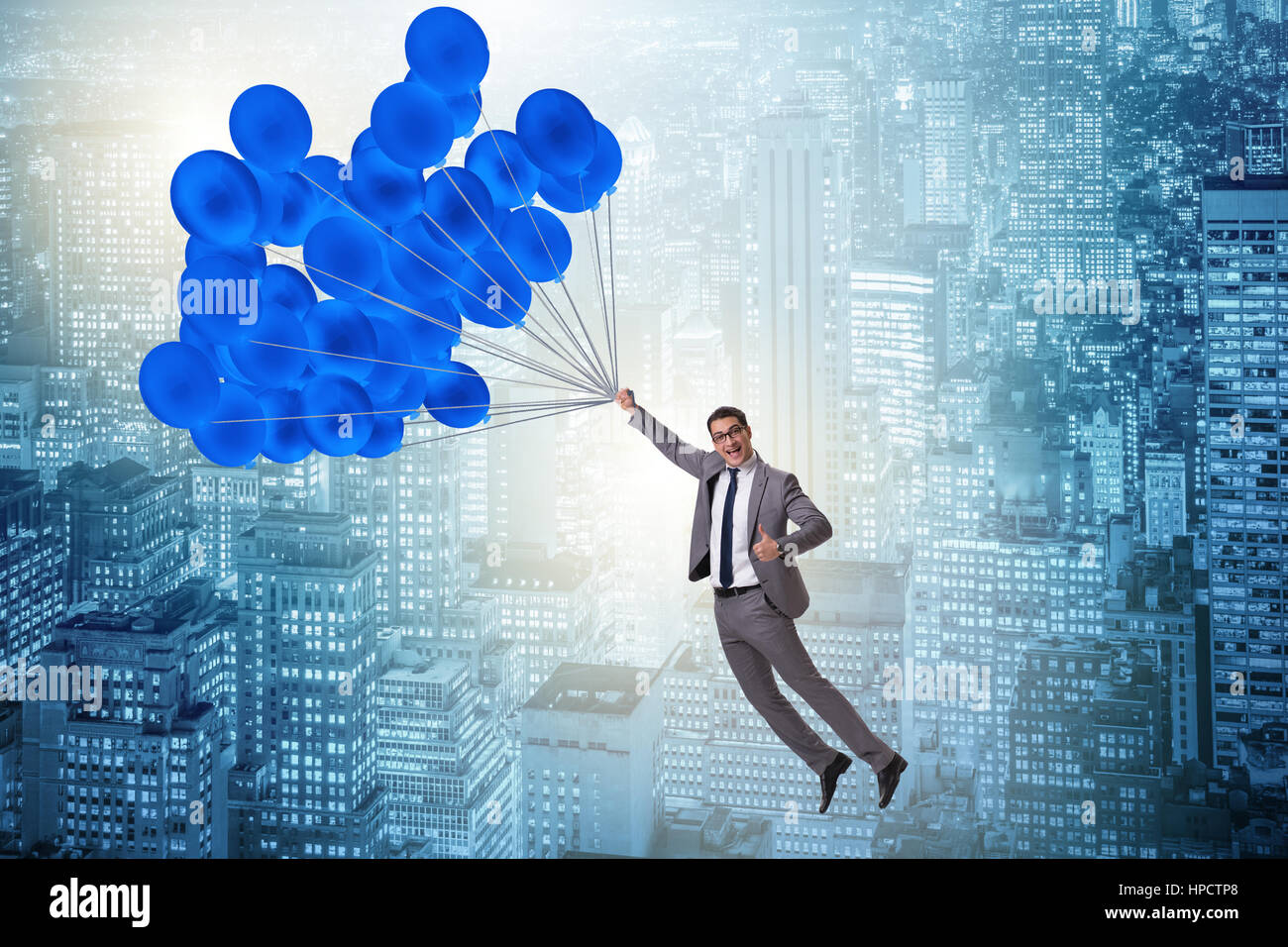 Businessman flying on balloon in challenge concept Stock Photo - Alamy