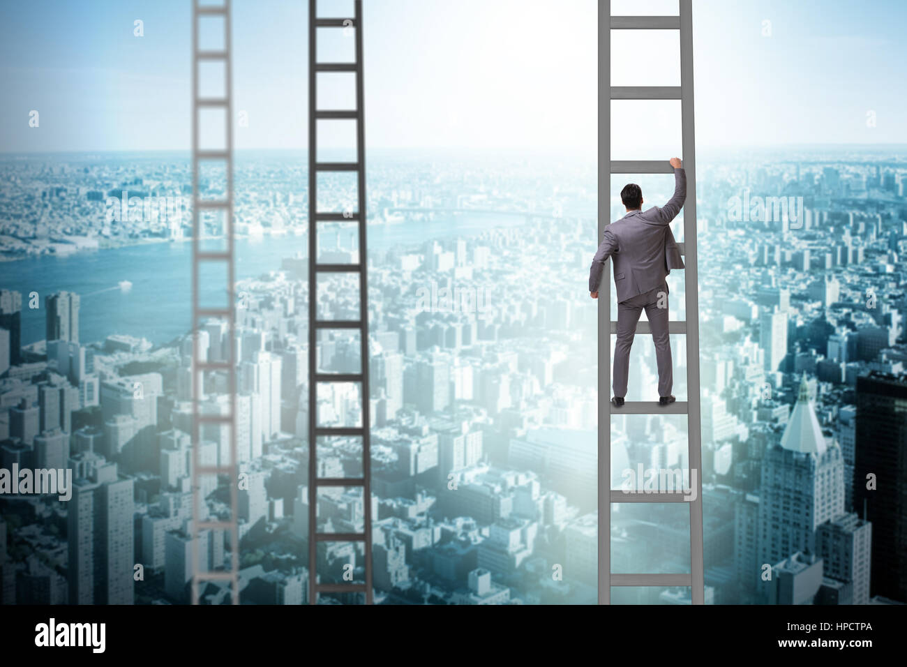Young businessman climbing career ladder Stock Photo - Alamy