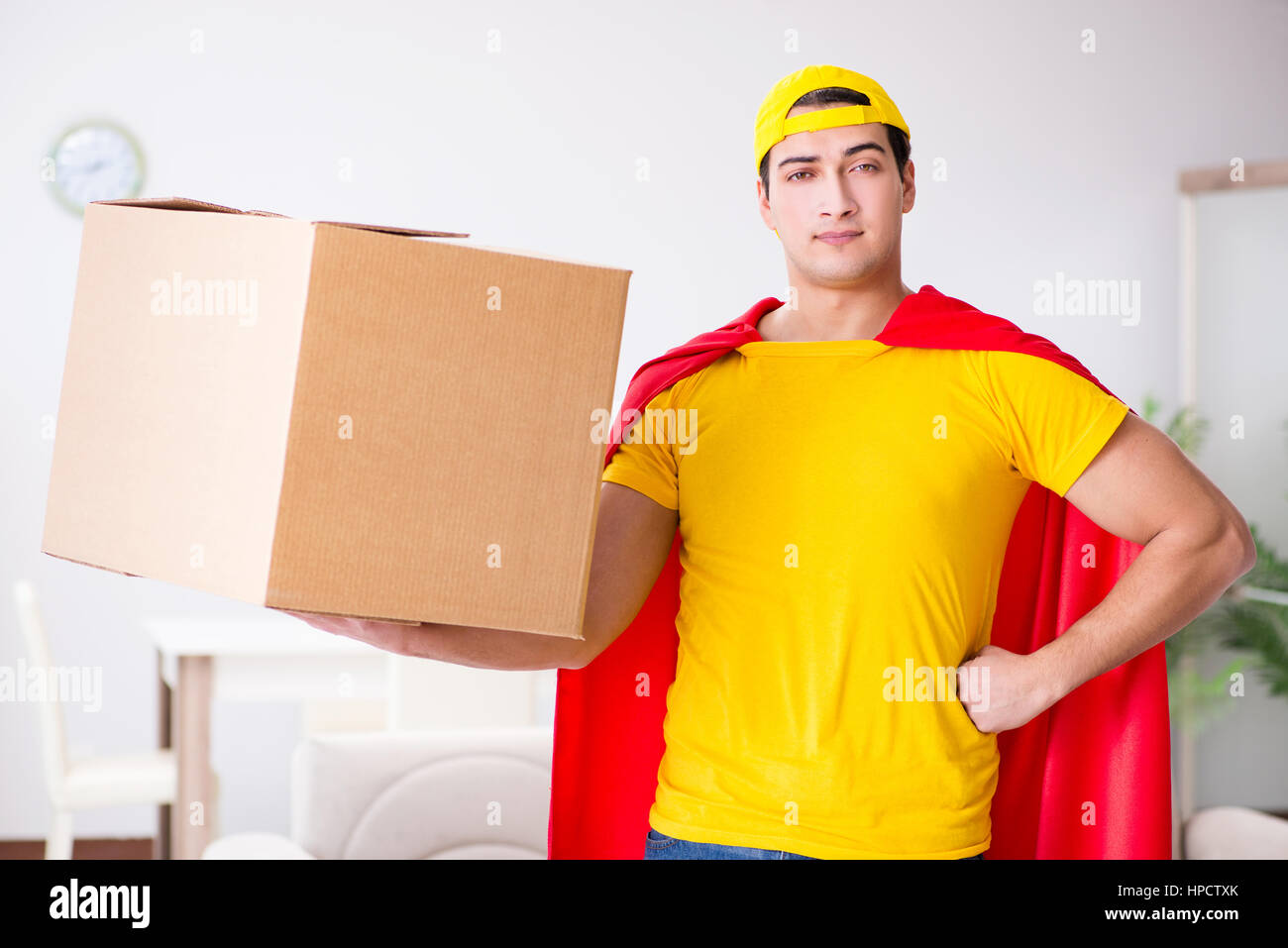 Superhero delivery guy with box Stock Photo - Alamy