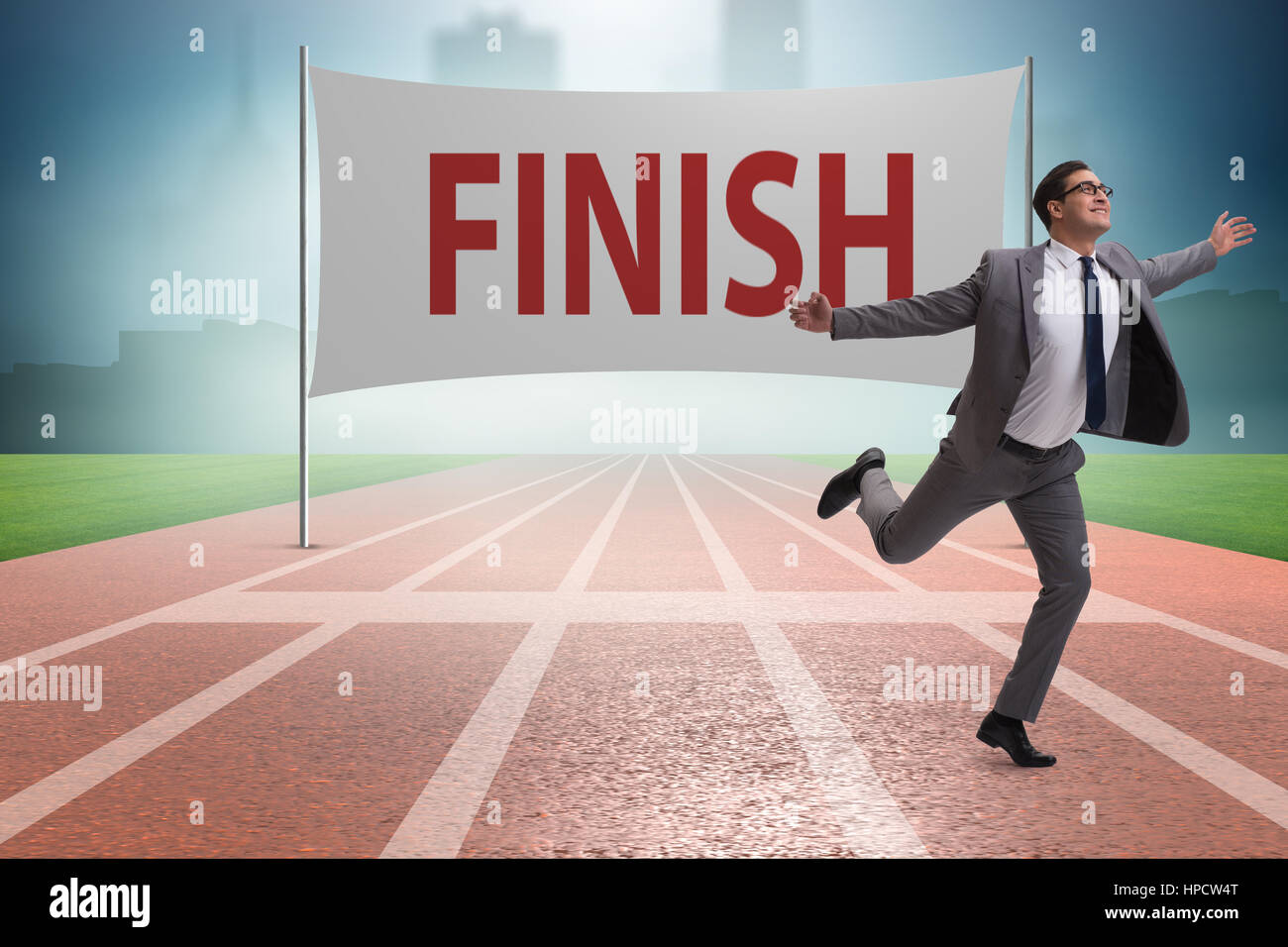 Businessman on the finishing line in competition concept Stock Photo ...