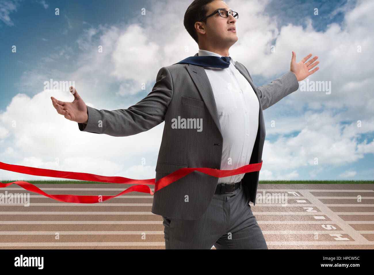 Businessman on the finishing line in competition concept Stock Photo ...