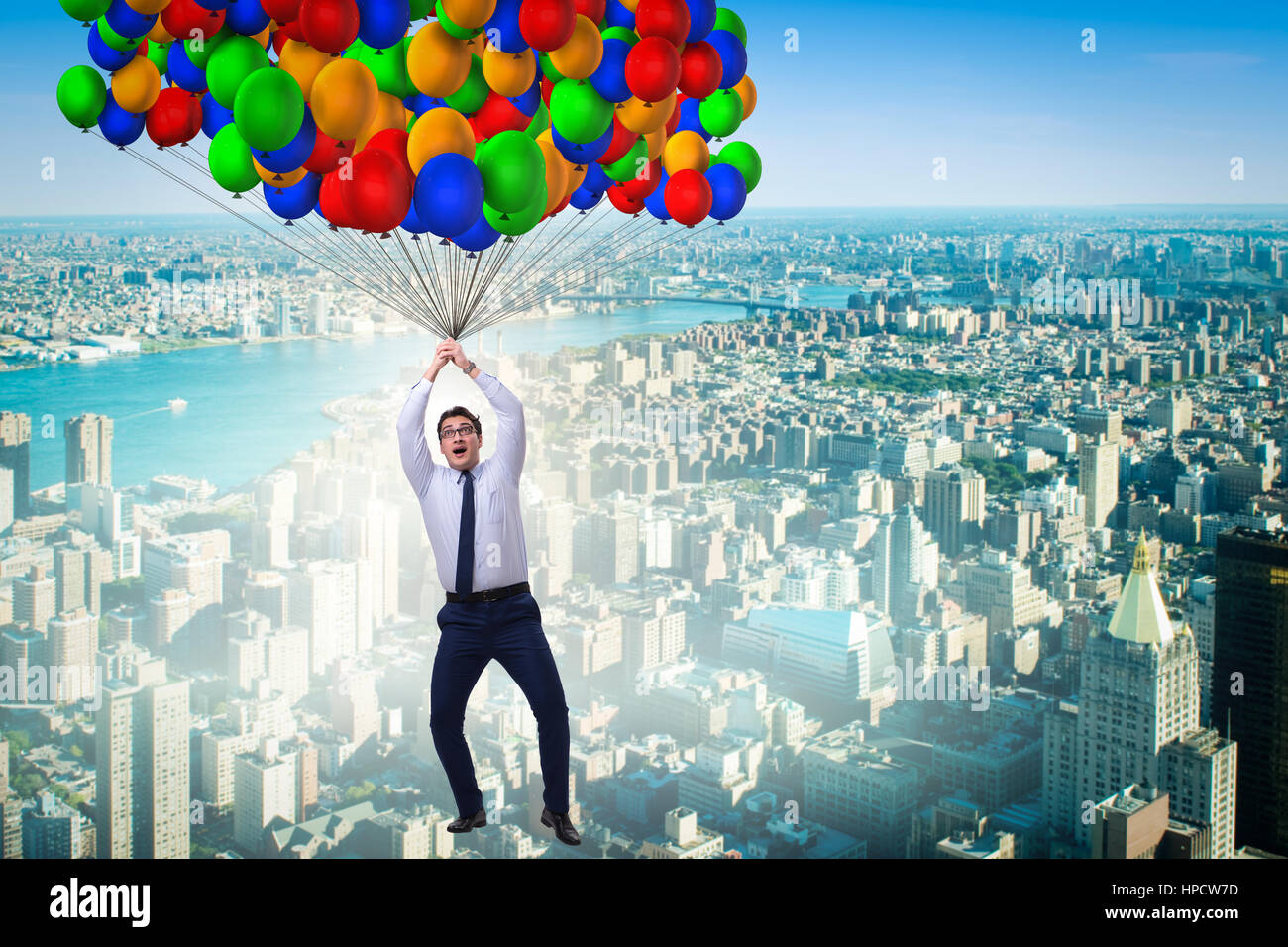 Businessman flying on balloons in challenge concept Stock Photo - Alamy