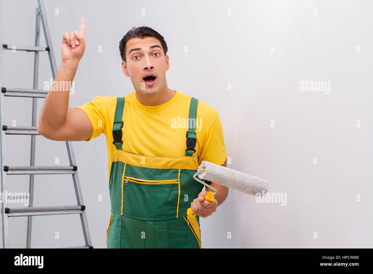 Man painting the wall in DIY concept Stock Photo - Alamy