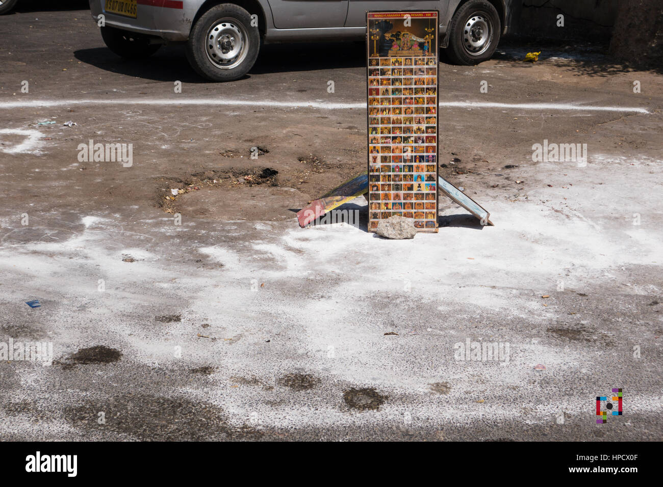 A frame containg photos of Indian Hindu Gods stands at Garbage dump ...