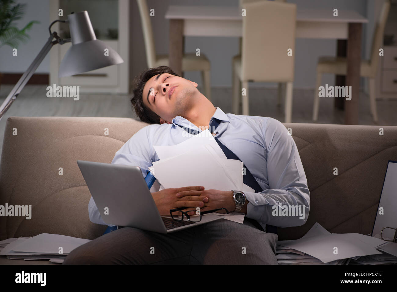 Businessman workaholic working late at home Stock Photo - Alamy