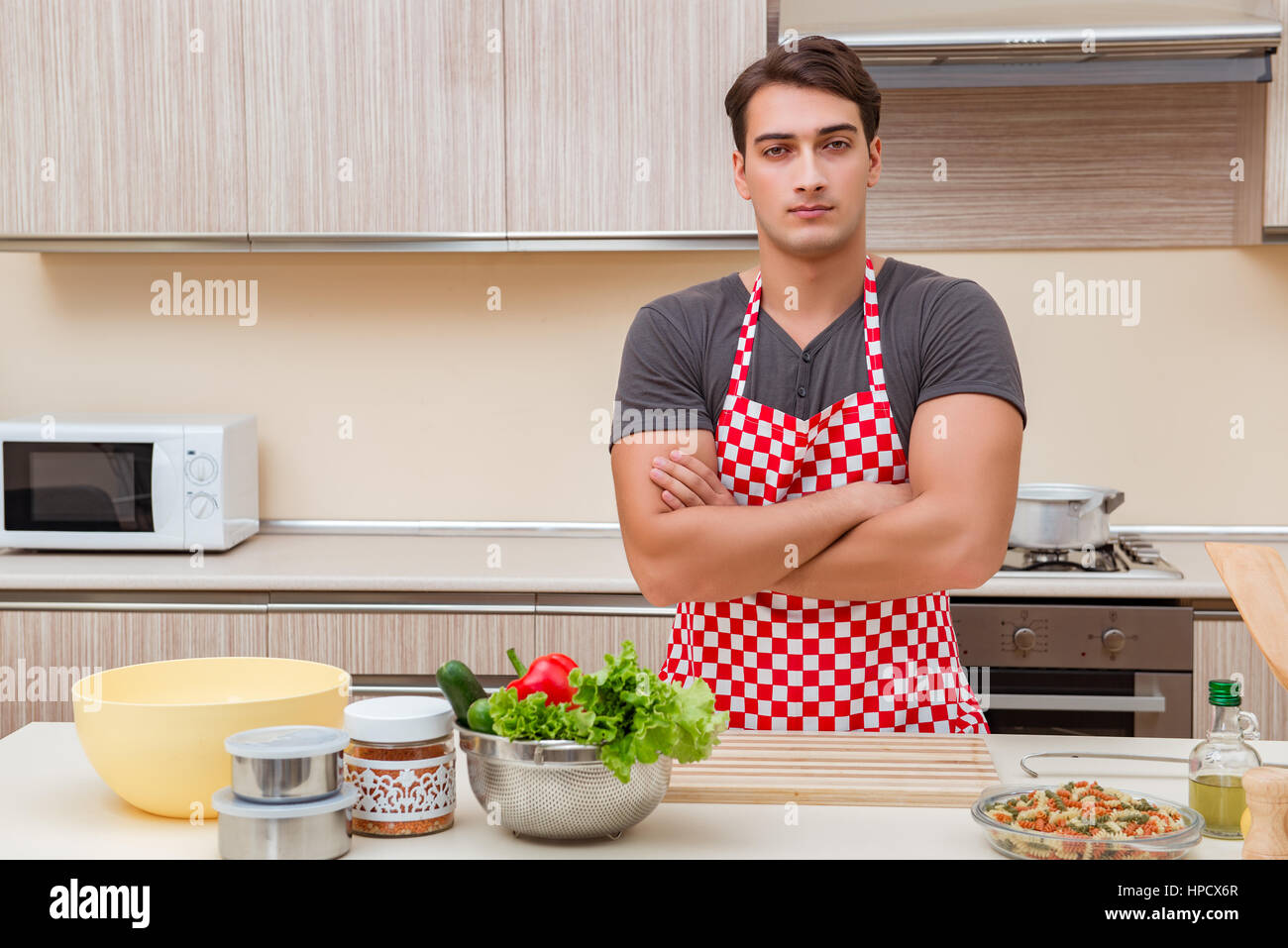 Man male cook preparing food in kitchen Stock Photo - Alamy