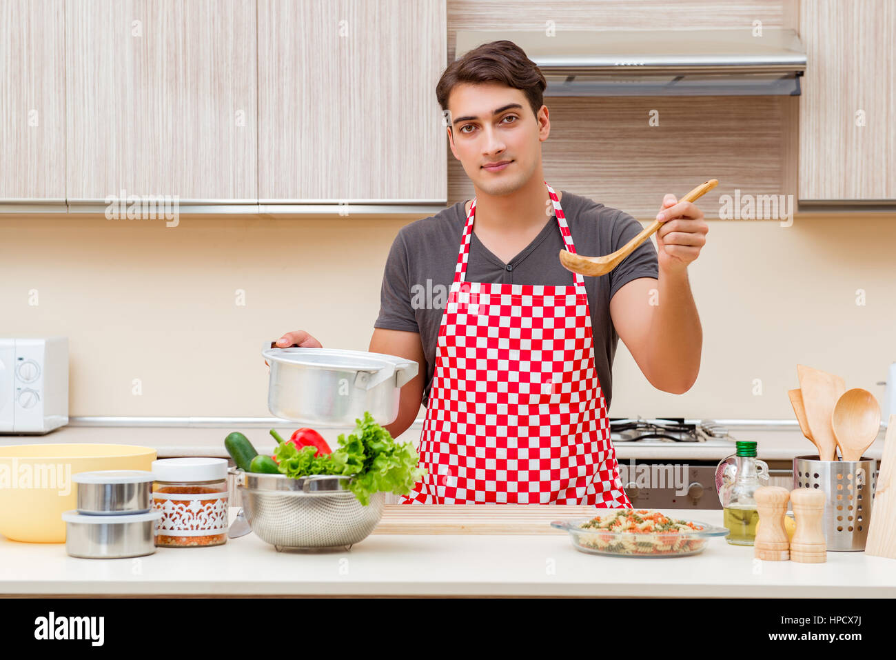 Man male cook preparing food in kitchen Stock Photo - Alamy
