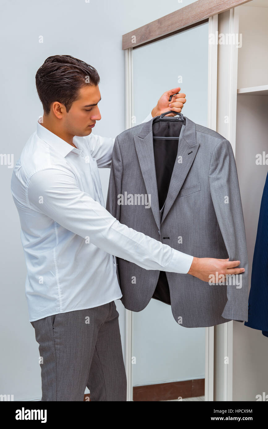 Businessman dressing up for work Stock Photo - Alamy