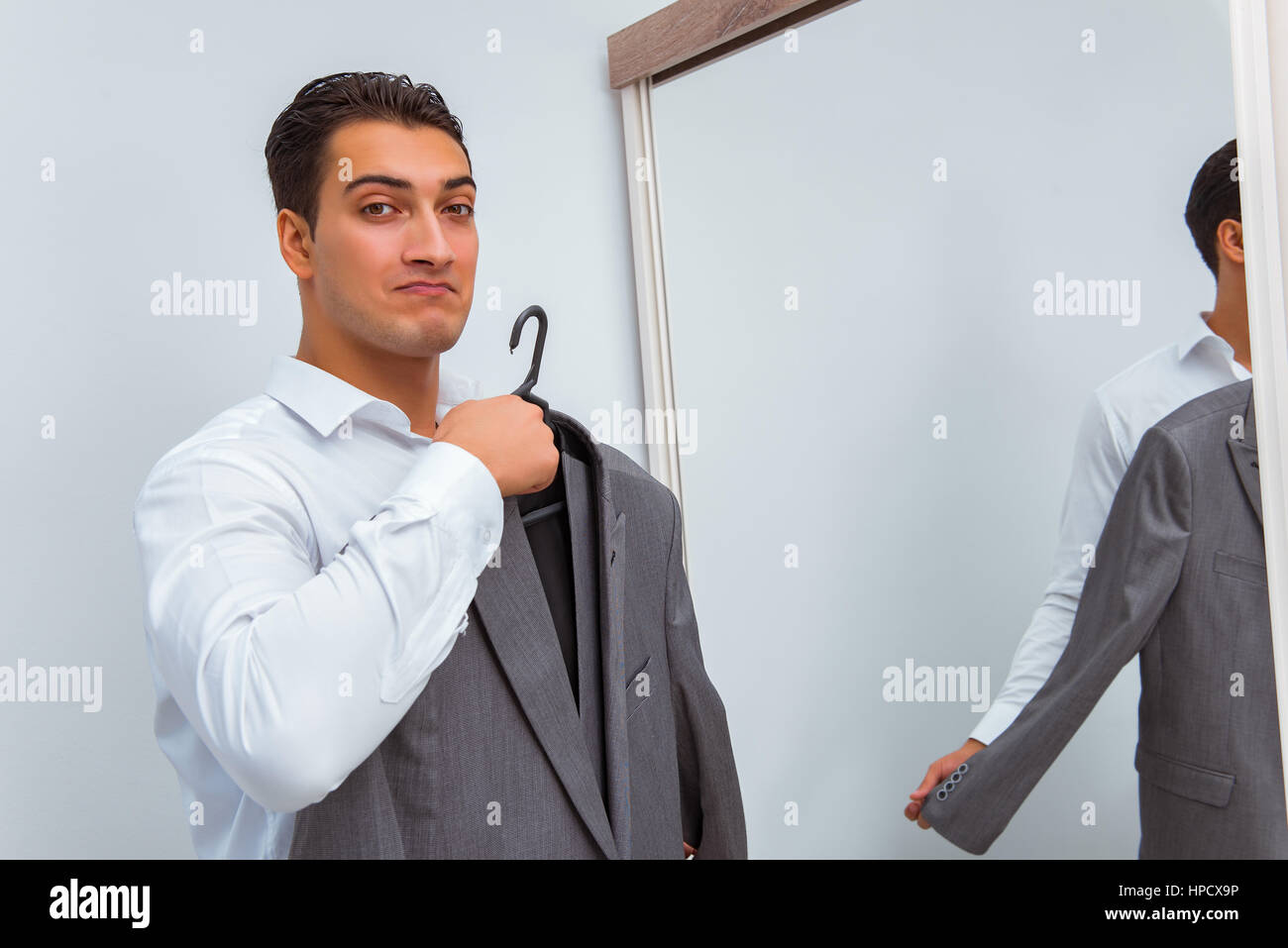Businessman dressing up for work Stock Photo - Alamy