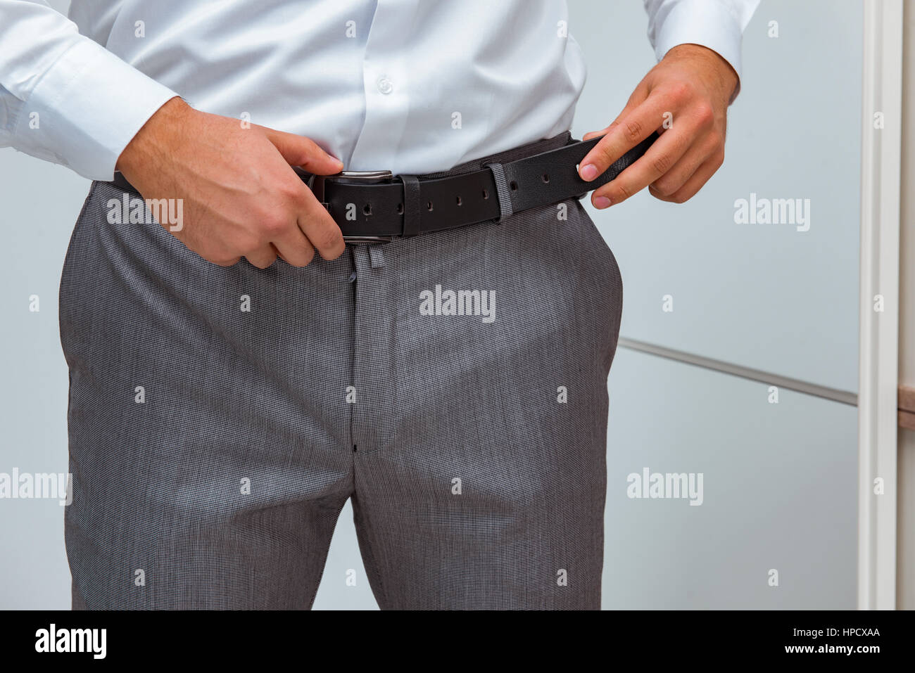 Businessman dressing up for work Stock Photo - Alamy