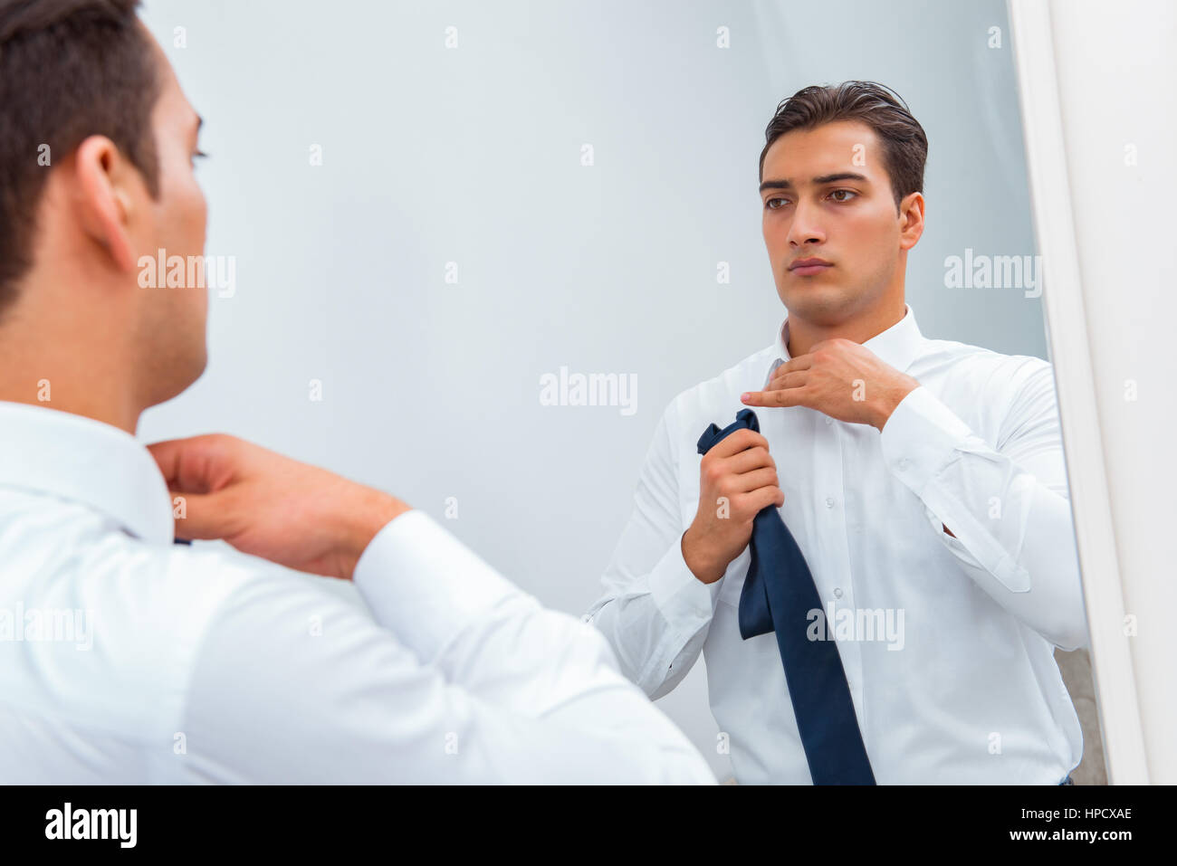 Businessman dressing up for work Stock Photo - Alamy