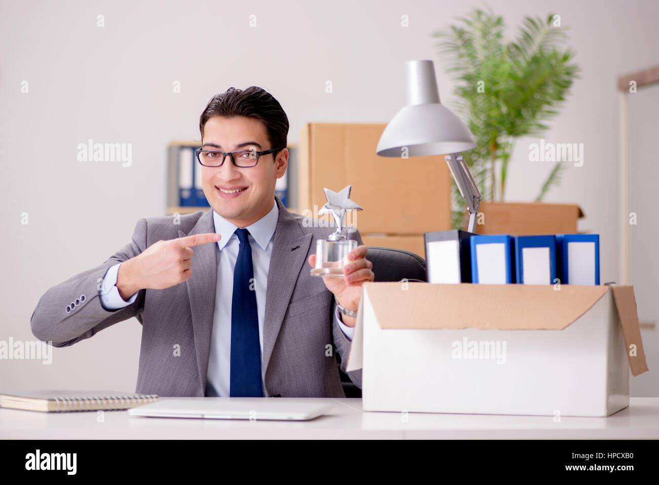 Businessman receiving star award in office Stock Photo - Alamy