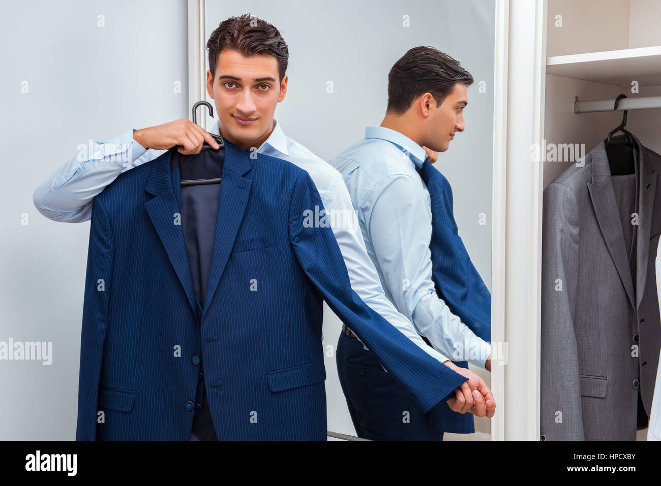 Businessman dressing up for work Stock Photo - Alamy