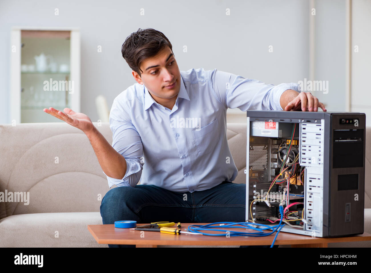 Frustrated man with broken pc computer Stock Photo - Alamy